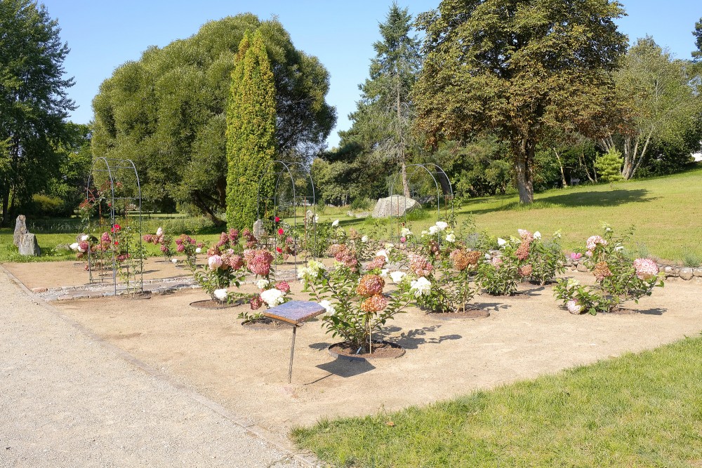 Historic stone building (Mosede Watermill) and bridge in a stone park ...
